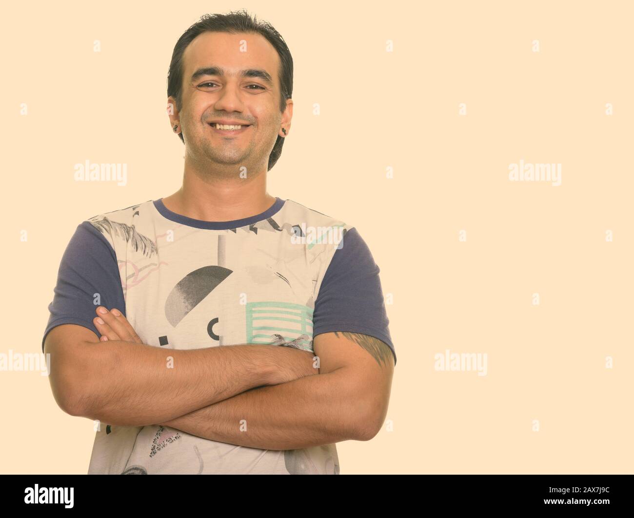 Happy persian man smiling arms hi-res stock photography and images - Alamy