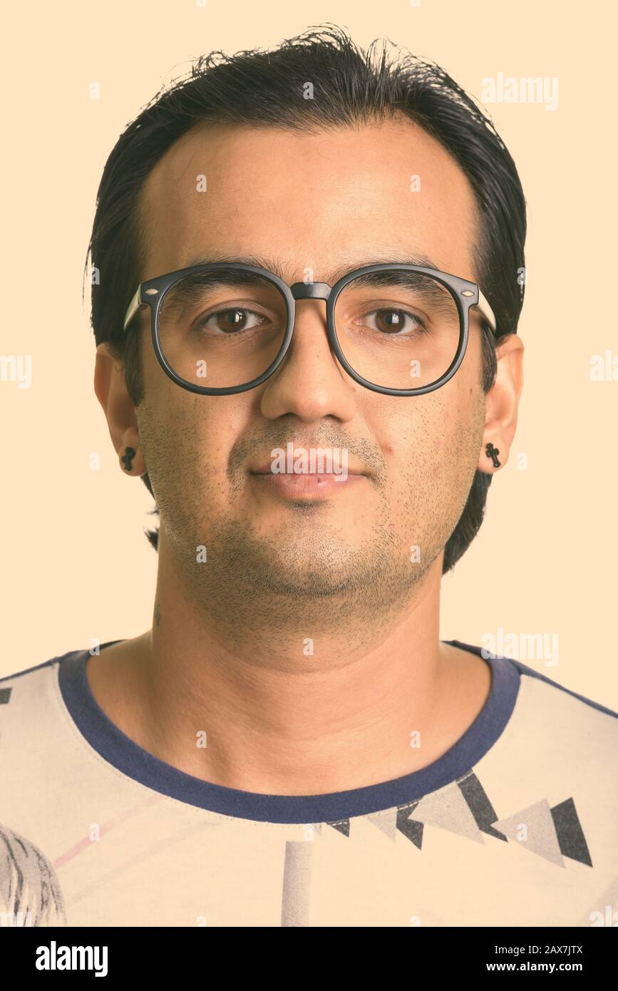 Face of Persian man with eyeglasses looking at camera Stock Photo - Alamy