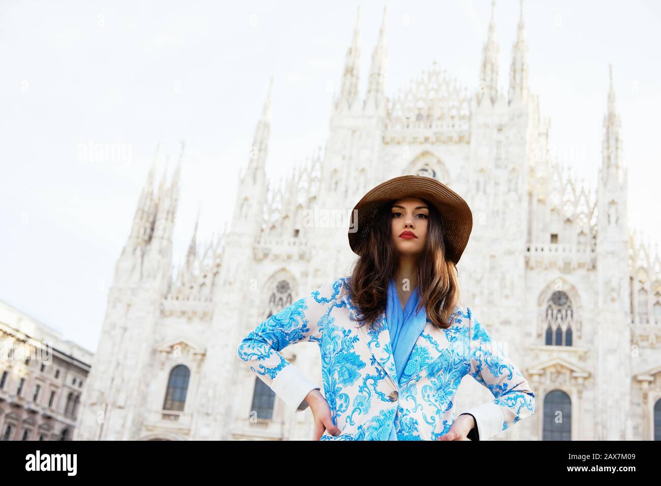 Portrait of a female model in front of the Duomo of Milan italy during ...
