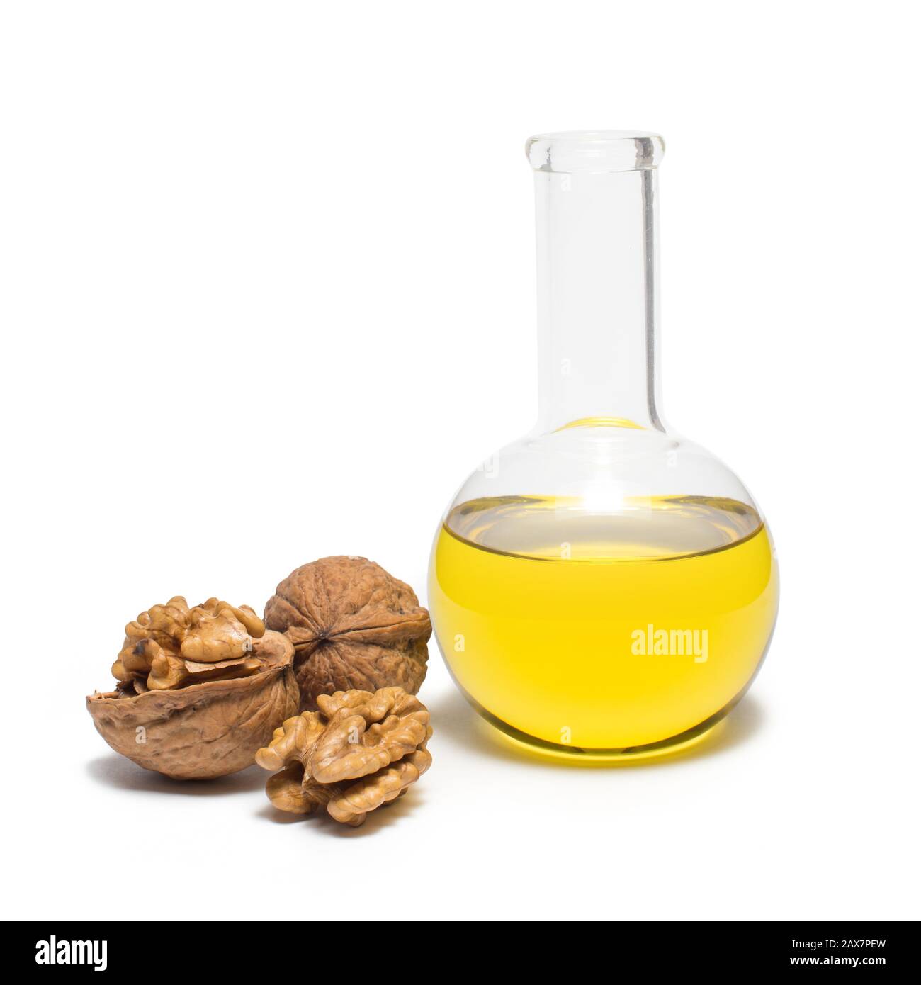 Walnut oil on white background Stock Photo - Alamy