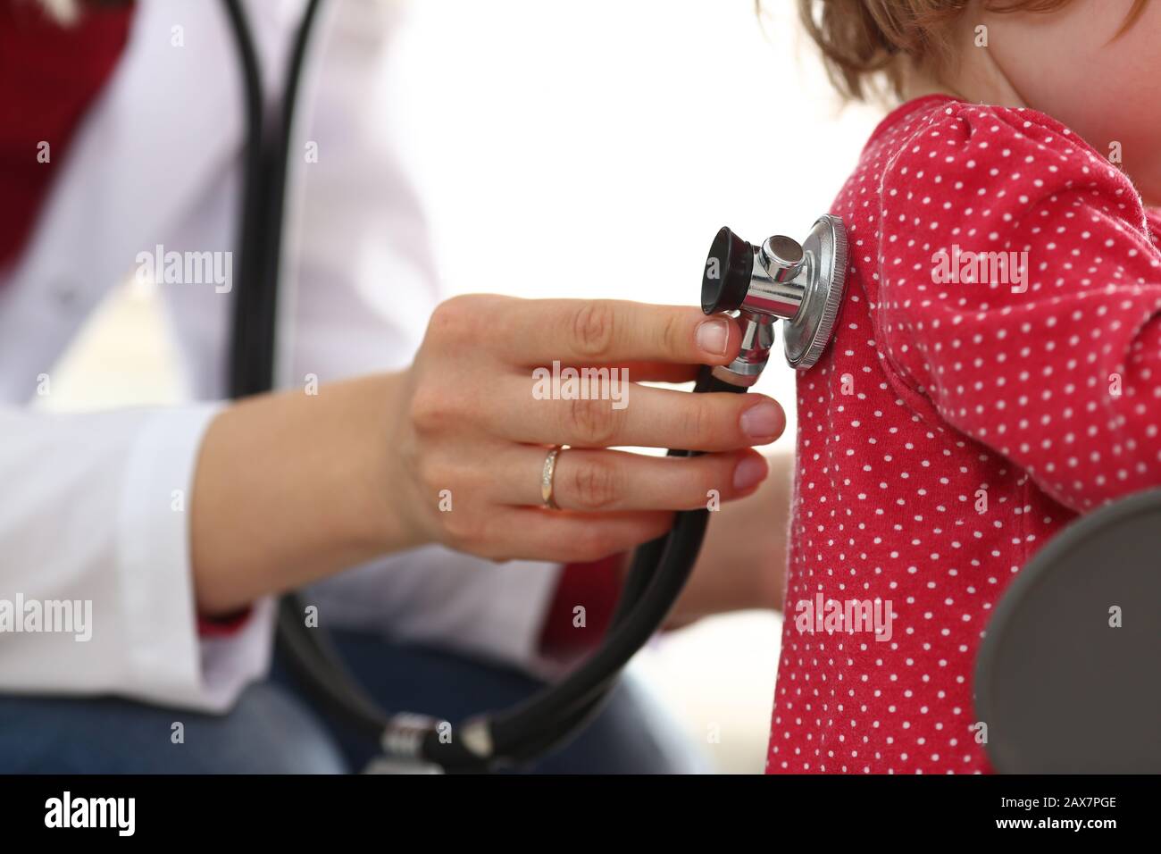 Little child with stethoscope at doctor reception Stock Photo - Alamy