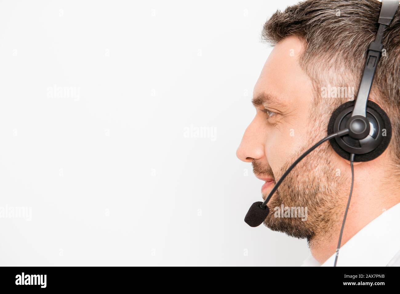 Side view of smiling operator of call center in headphones Stock Photo ...