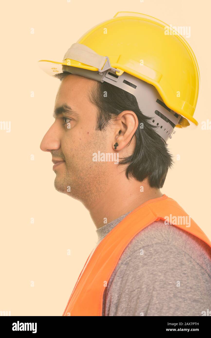 Close up profile view of happy Persian man construction worker smiling ...