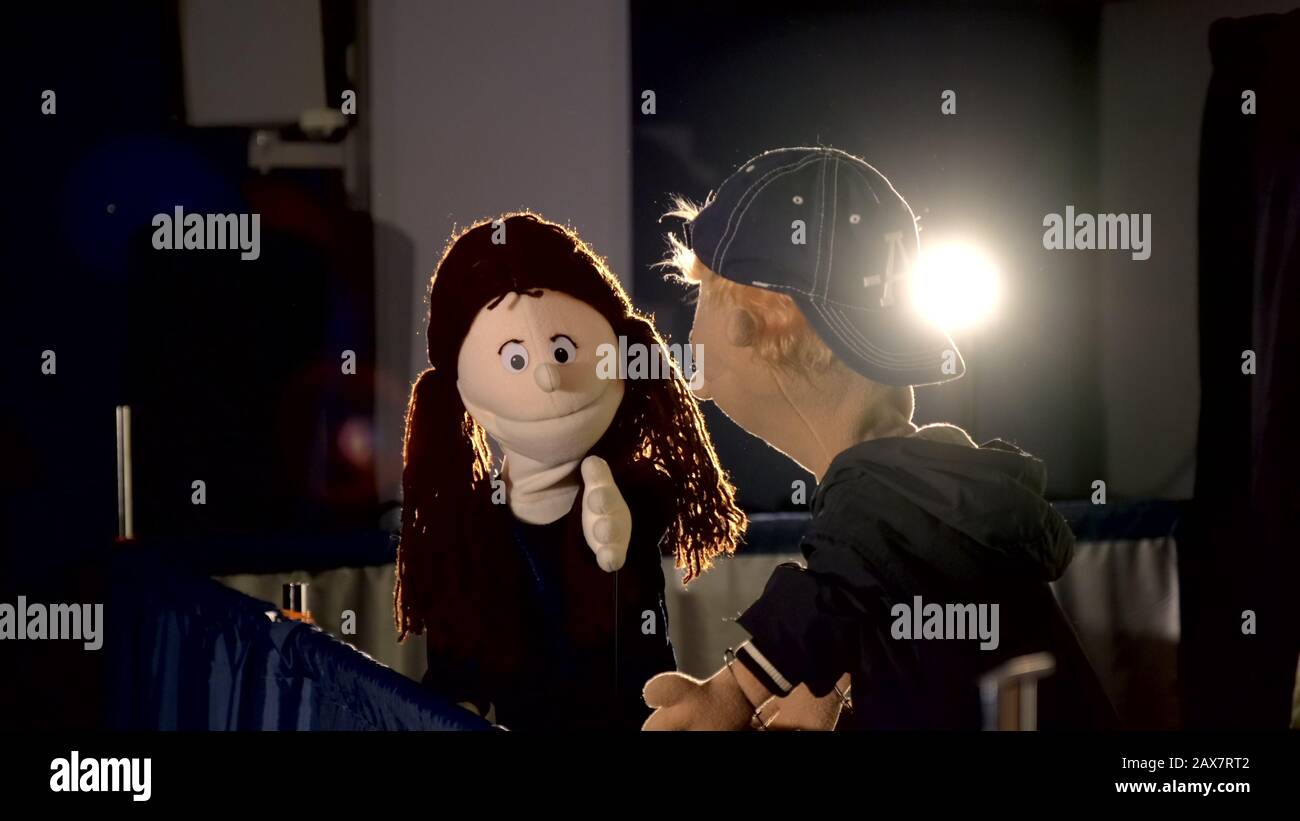 Puppet girl speaking with puppet boy during the performance. In the ...