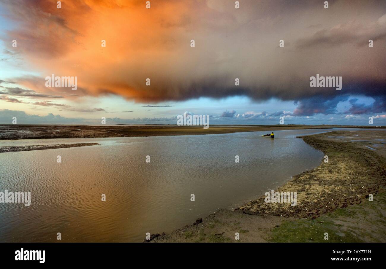 Returning with harvested mussels River Stiffkey Blakeney Harbour ...