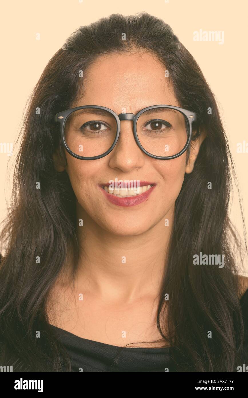 Face of happy Persian woman smiling while wearing eyeglasses Stock ...