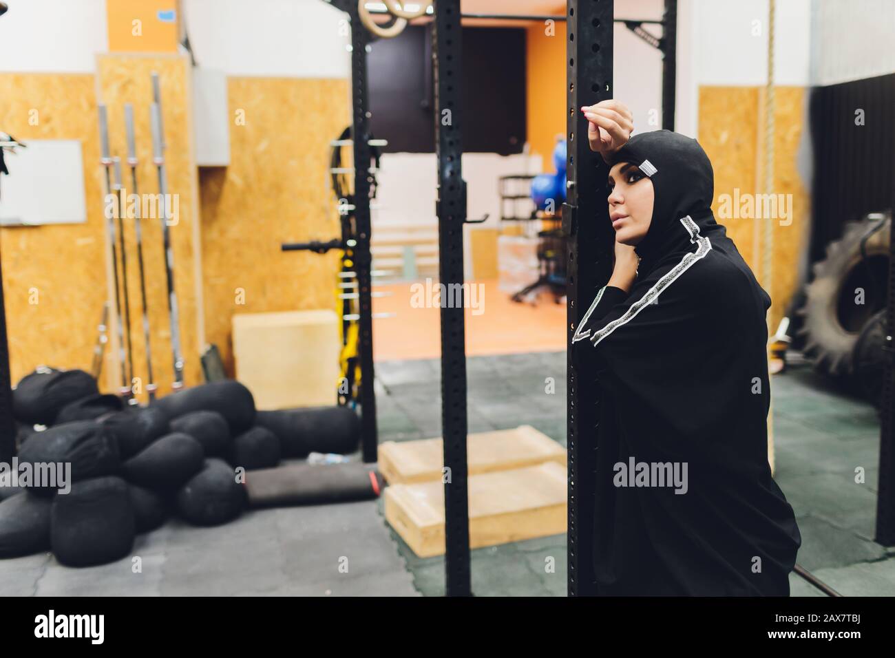 Muslim asian woman in hijab exercizing in a gym Stock Photo - Alamy