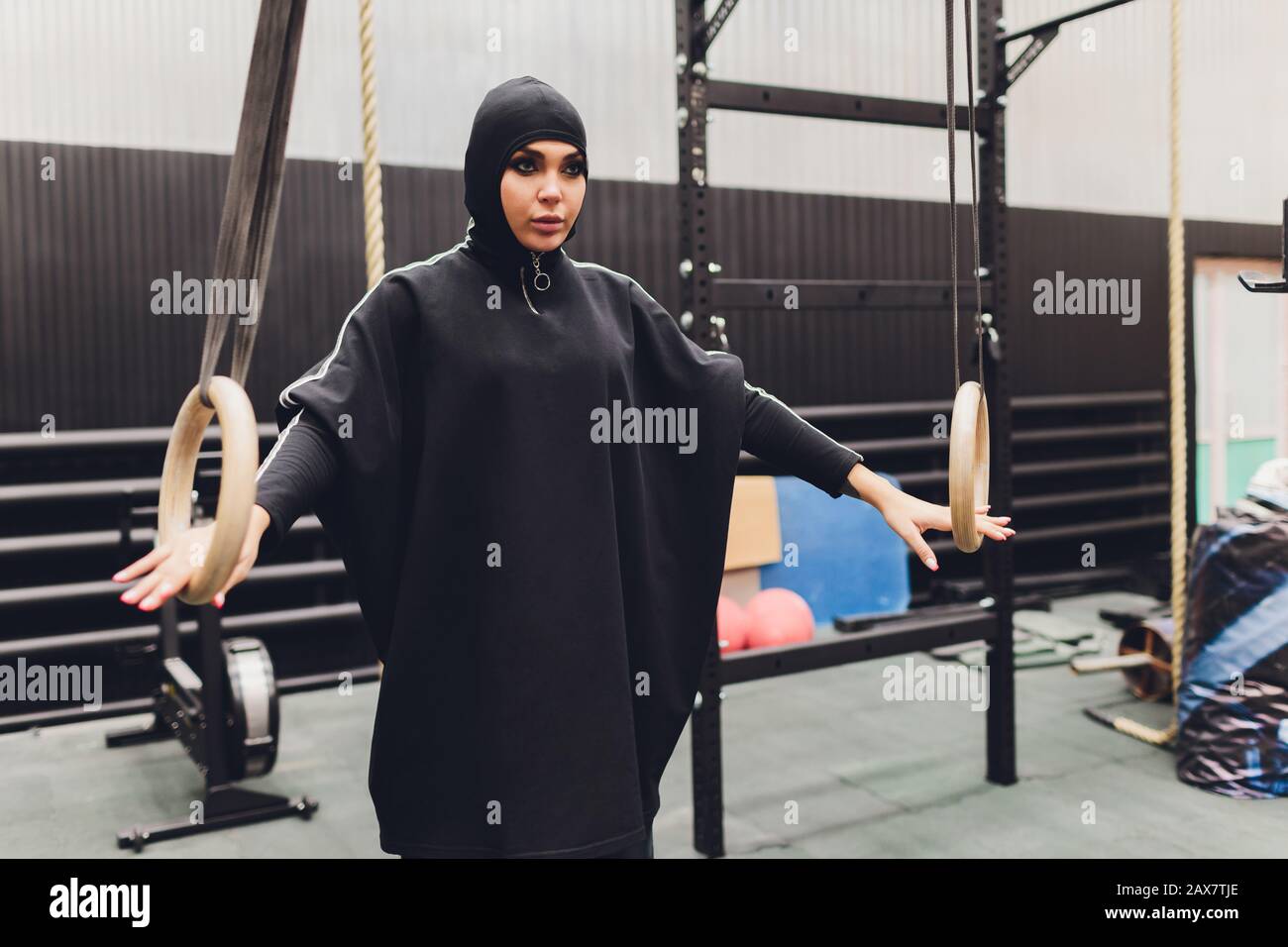 Muslim asian woman in hijab exercizing in a gym Stock Photo - Alamy