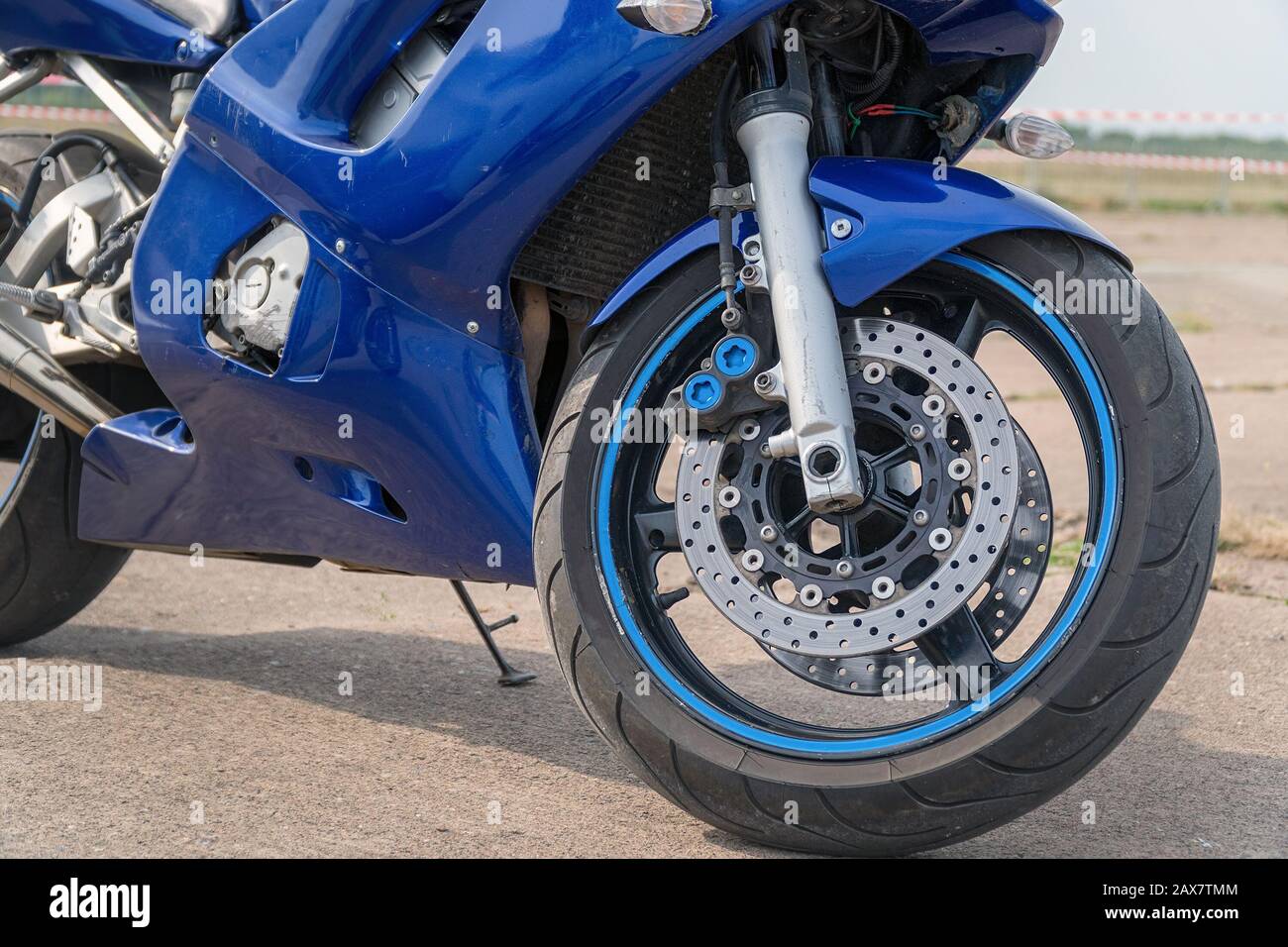 Blue road bike front wheel with front disc brake Stock Photo - Alamy