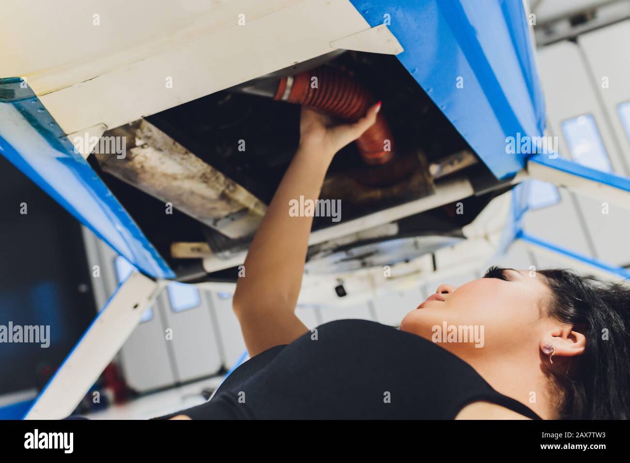 female helicopter maintenance worker Engineer maintaining a heavy Stock ...