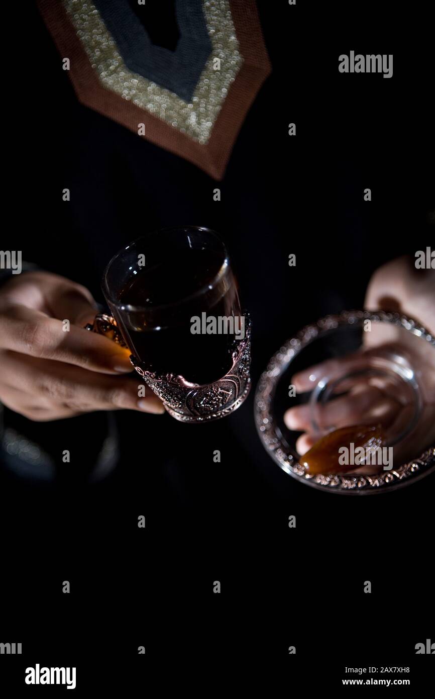 An arab woman holding the gawa (Arabian Coffee Stock Photo - Alamy