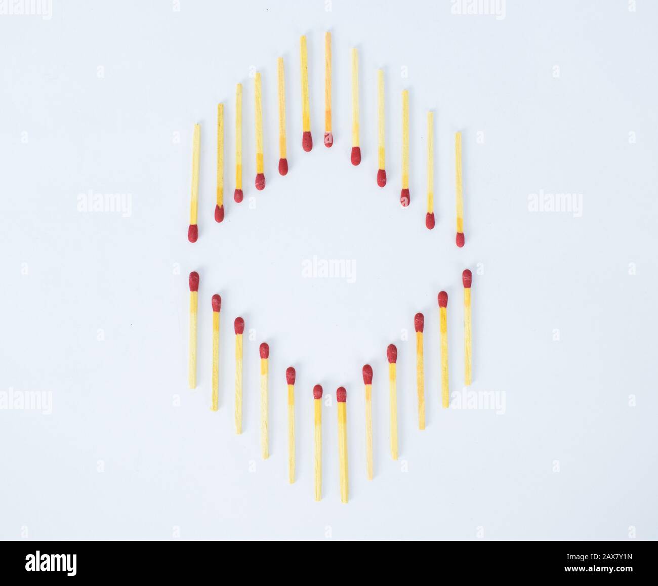 Two opposite directed row of red wooden matchsticks arranged as a frame ...