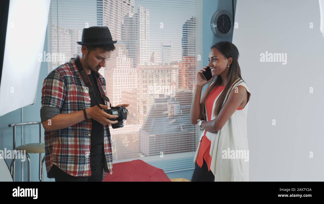 Professional photographer asking model to stop talking on smartphone ...
