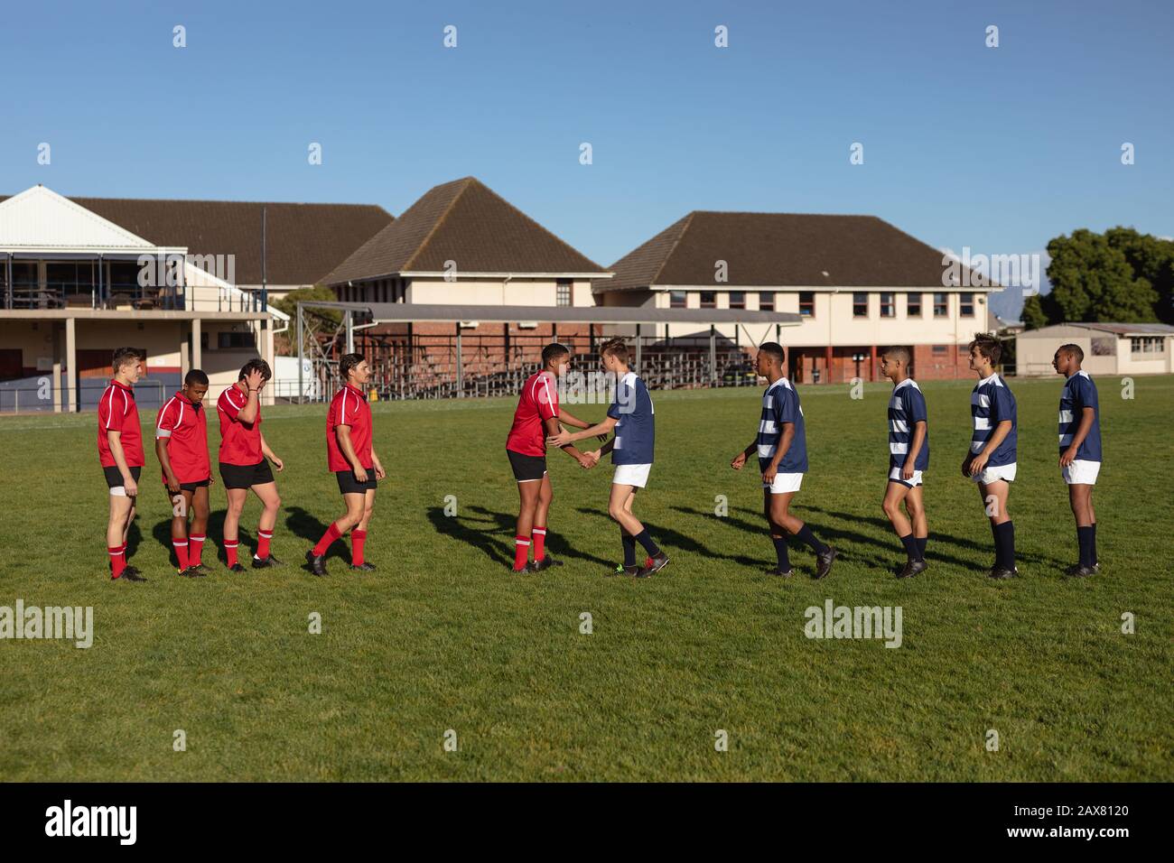 Rugby players shaking hands Stock Photo - Alamy