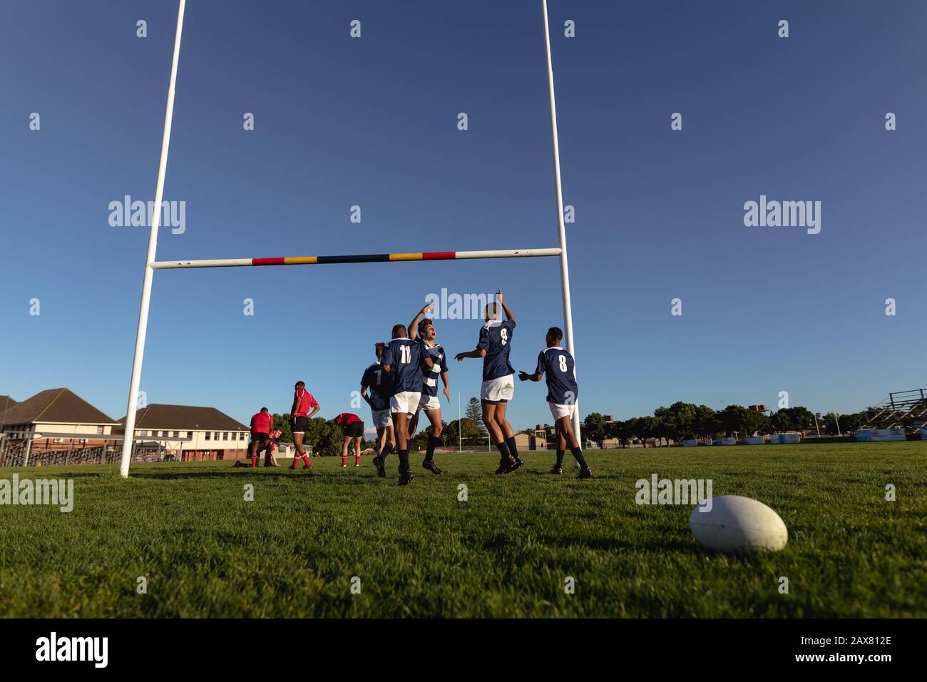 Rugby players high five Stock Photo - Alamy