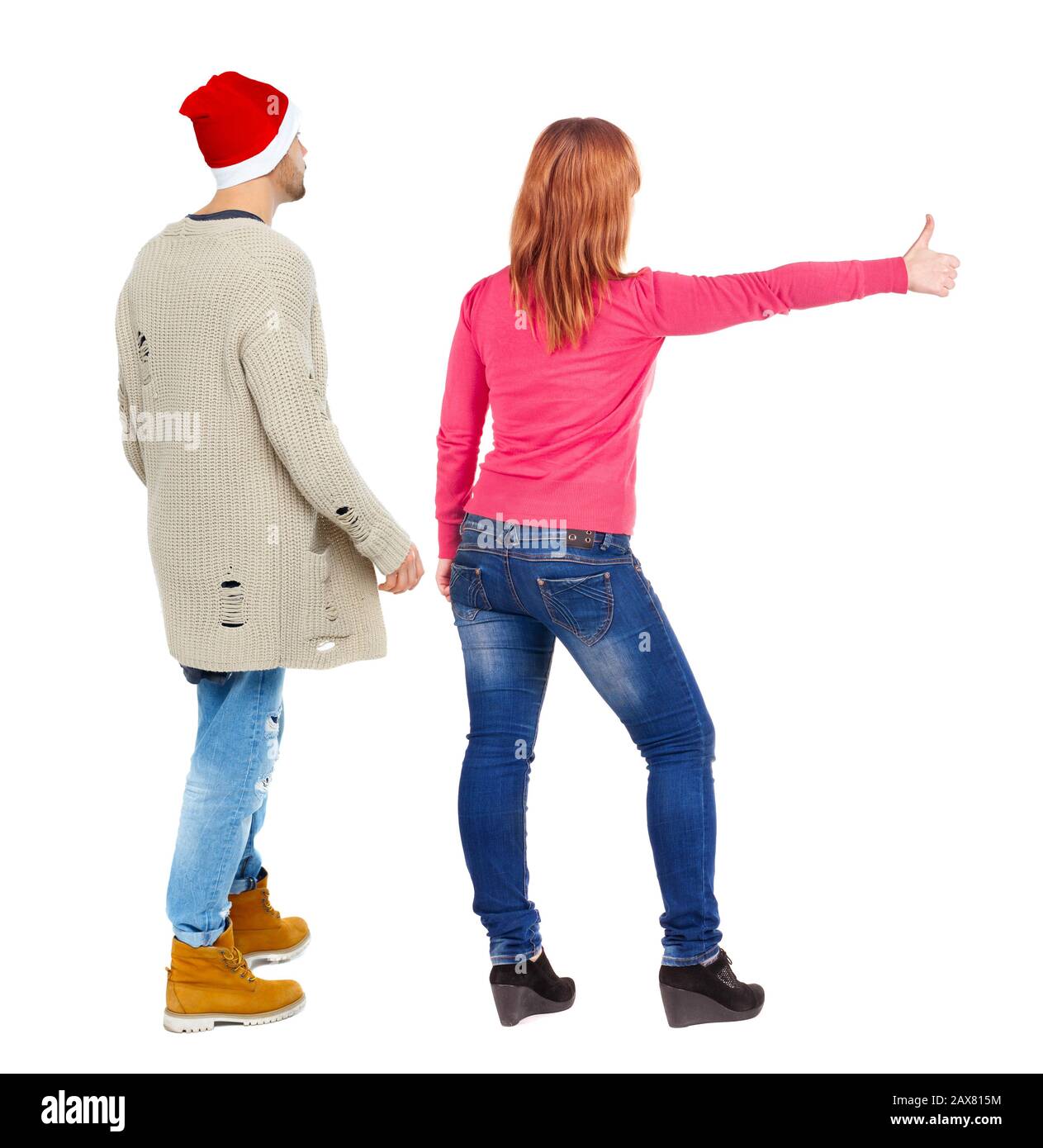 Back view of couple couple in sweater showing thumbs up. beautiful ...