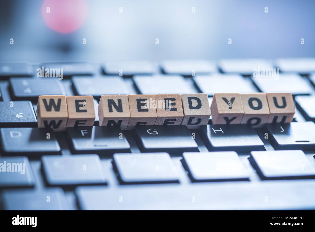 “We need you” letters on black keyboard, close up. Human resources ...