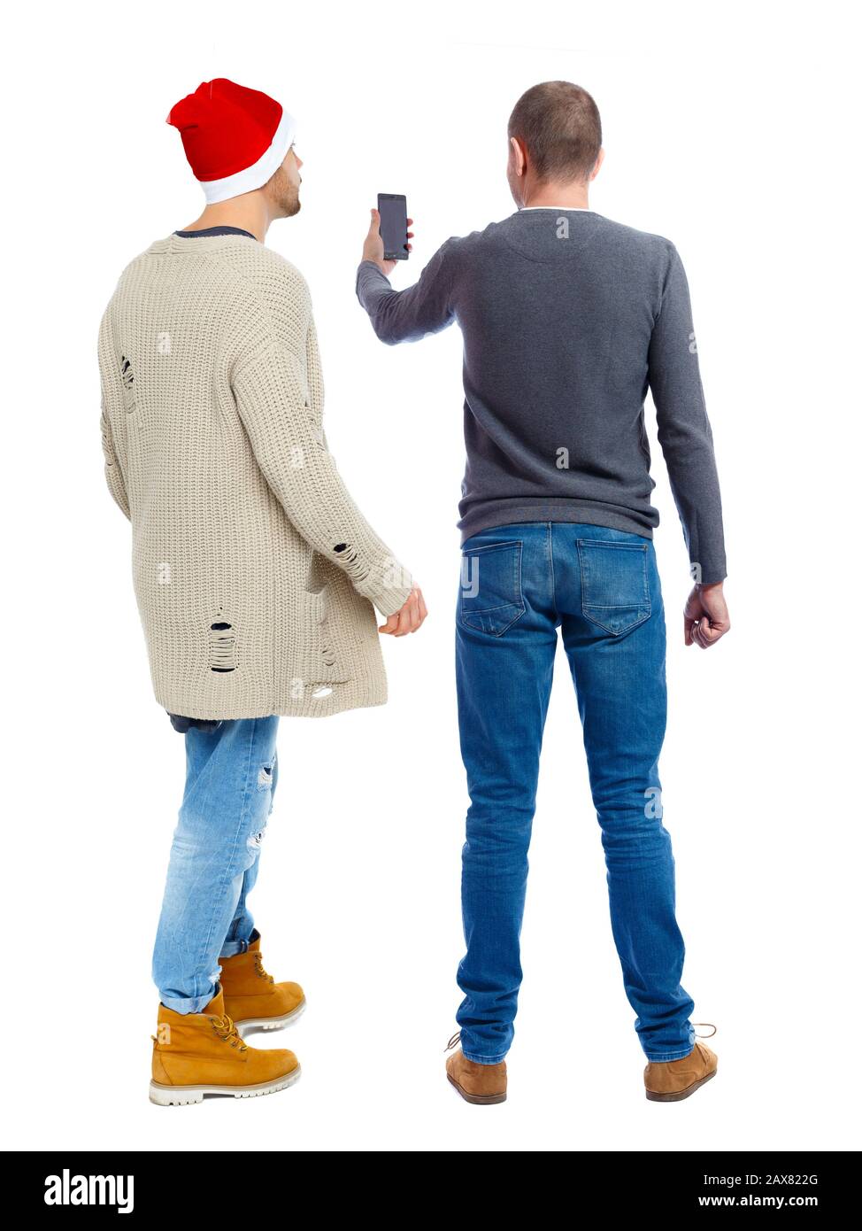 Back view of two man in sweater with mobile phone. Rear view people ...
