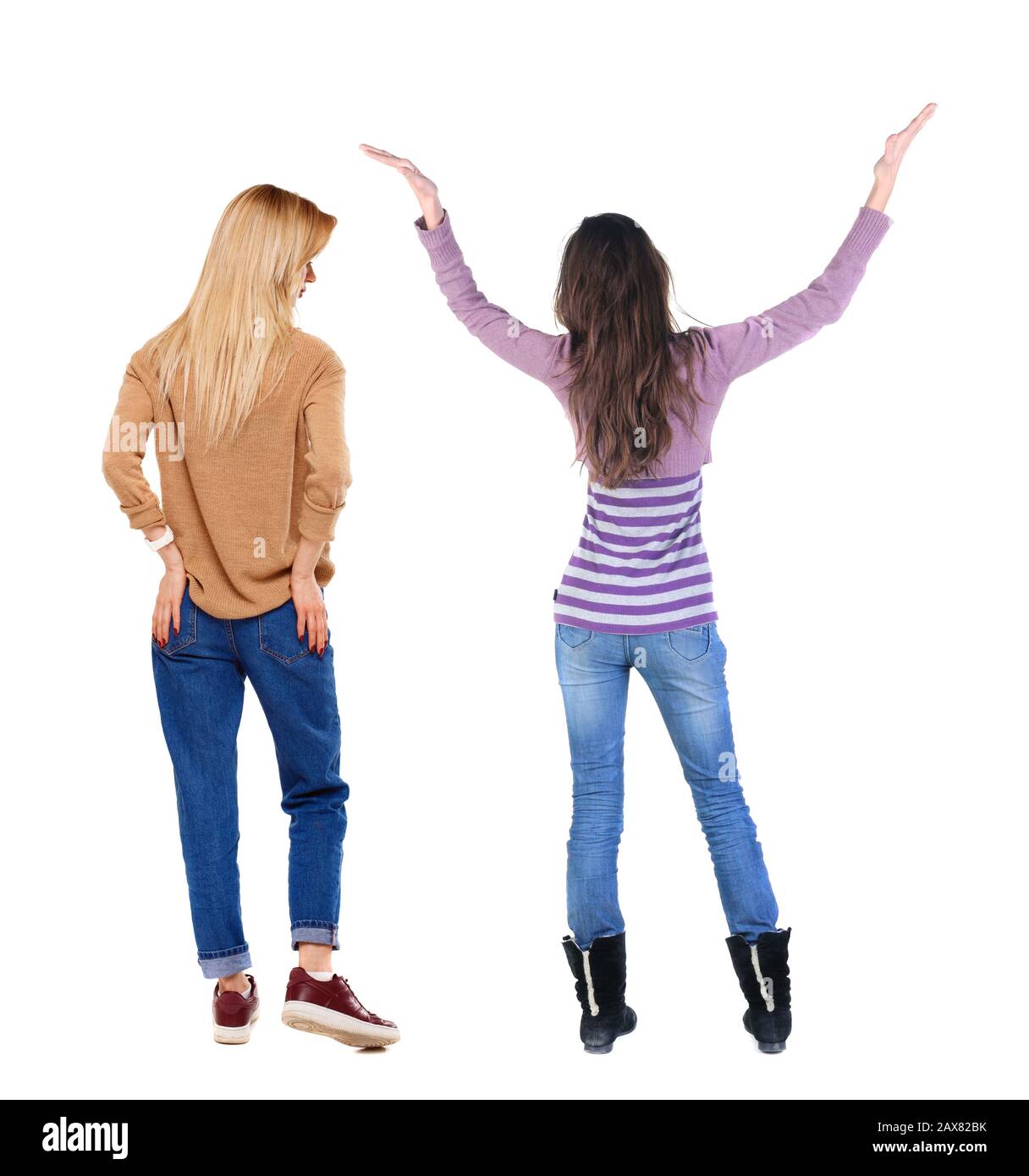 Back view of two woman in sweater. beautiful friendly girl and guy ...