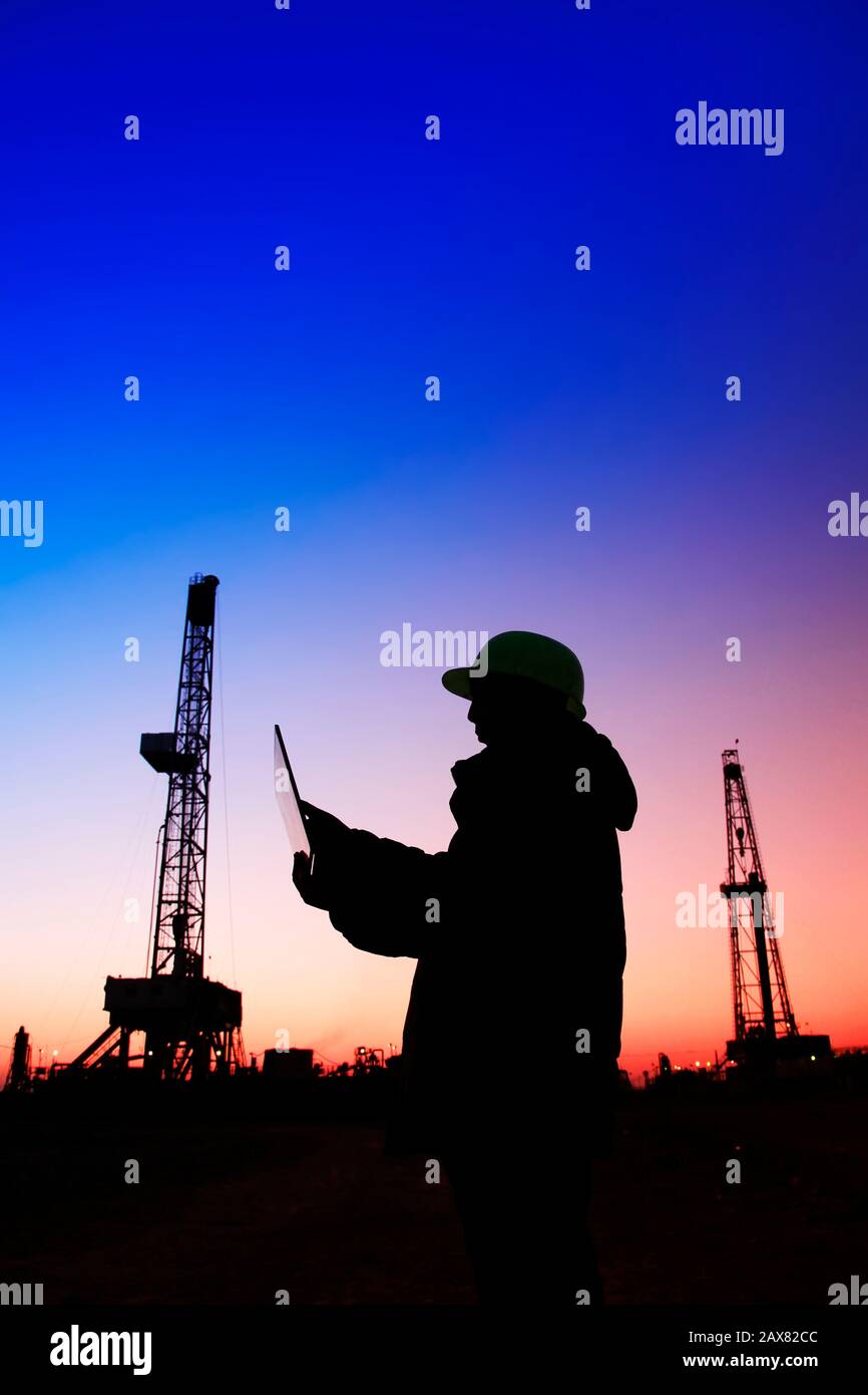 oil field, the oil workers are working Stock Photo - Alamy