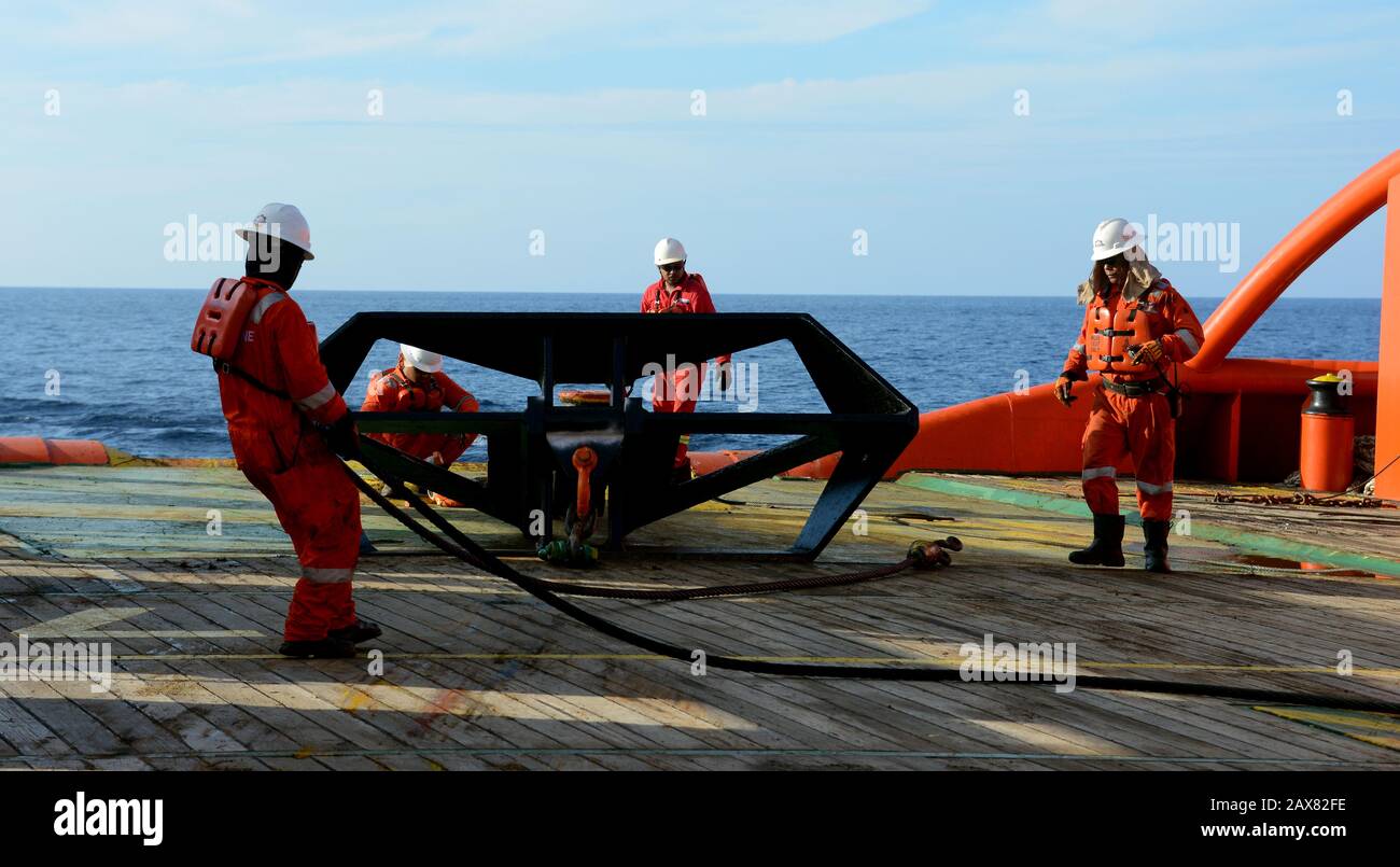 marine crew commencing work on deck for anchor handling operation Stock ...