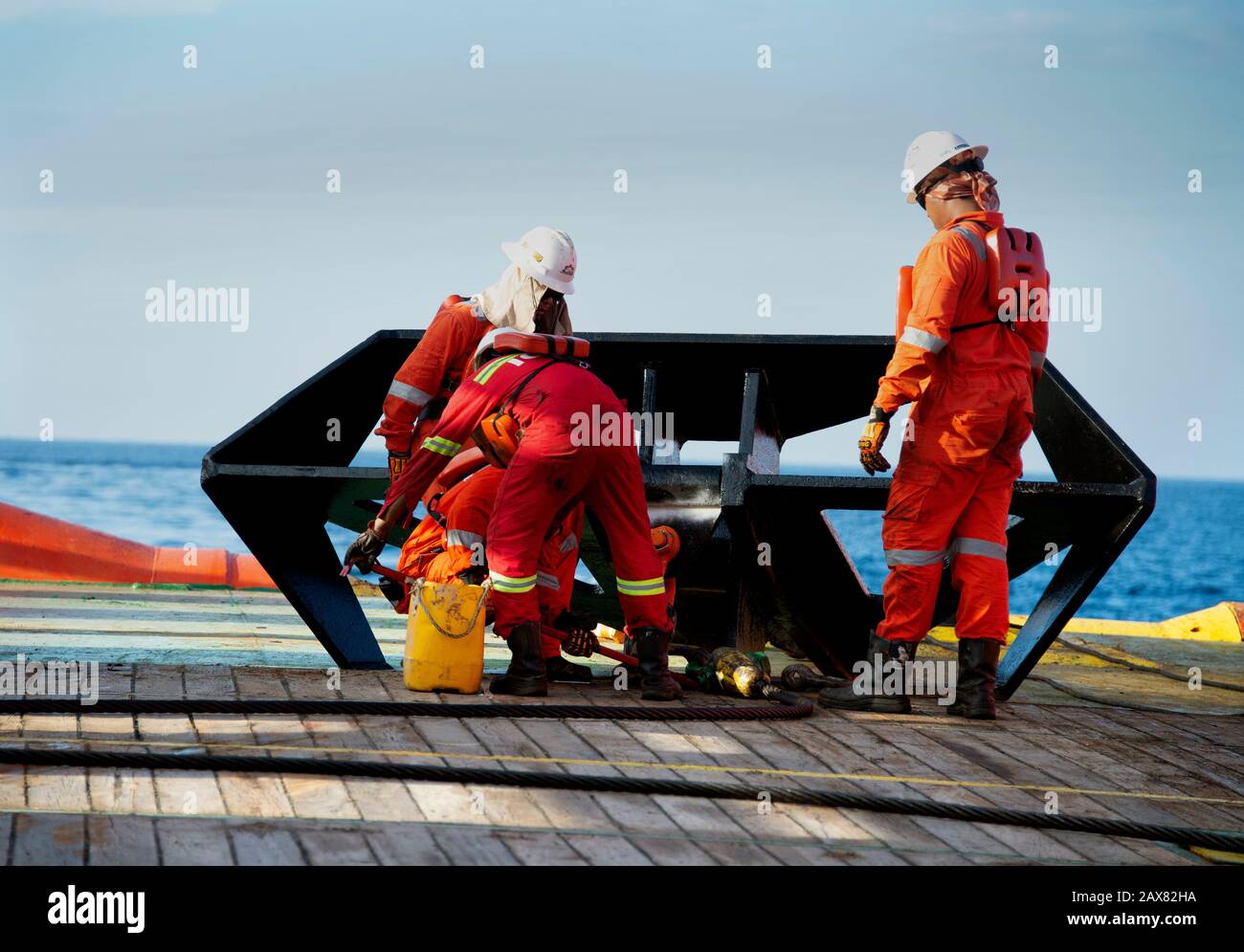 marine crew commencing work on deck for anchor handling operation Stock ...
