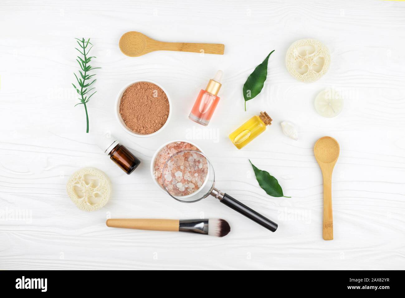 Homemade spa cosmetic set with salt and oil on white wooden background ...