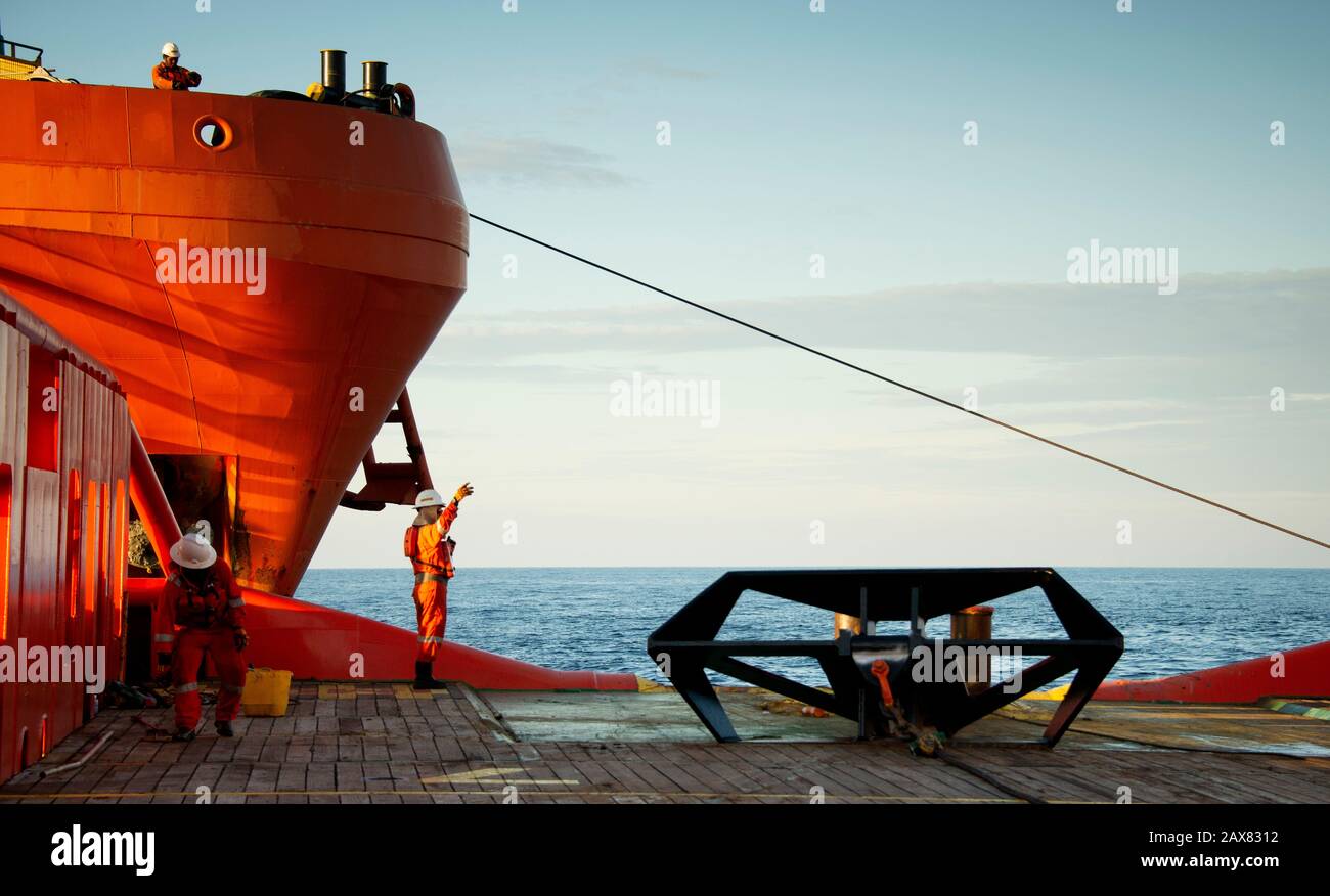 marine crew commencing work on deck for anchor handling operation Stock ...