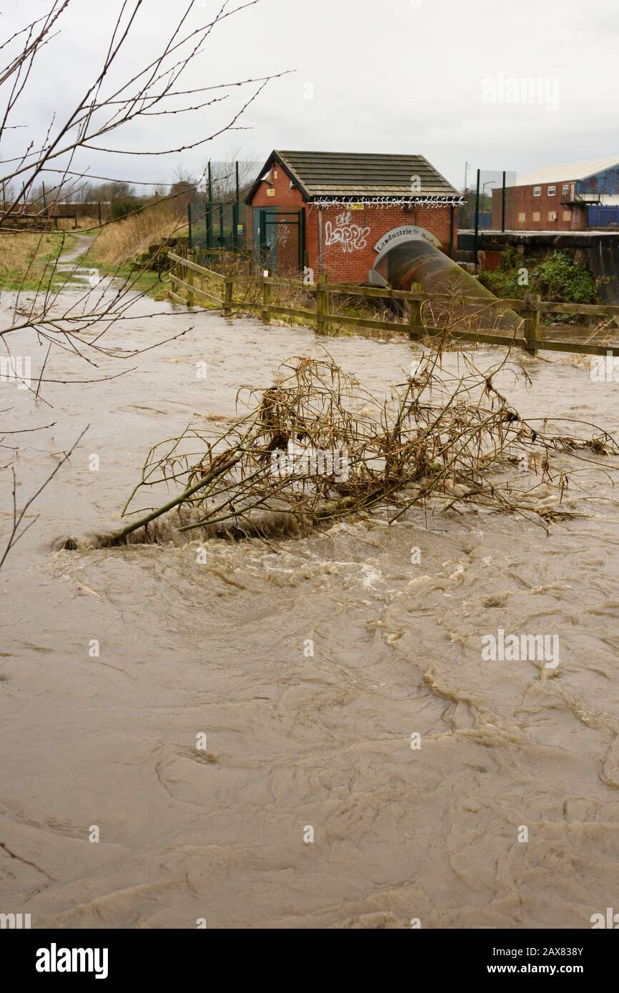 Storm ciara, River irwell bursts its banks with industrial buildings in ...