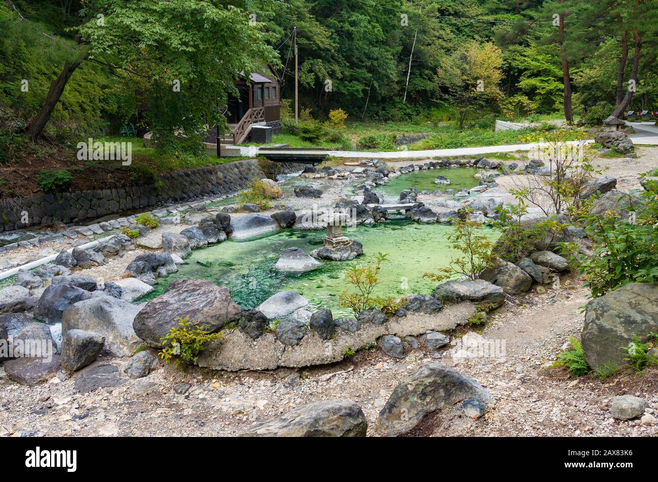 Hot spring pool with mineral water in Kusatsu public park in Japan ...