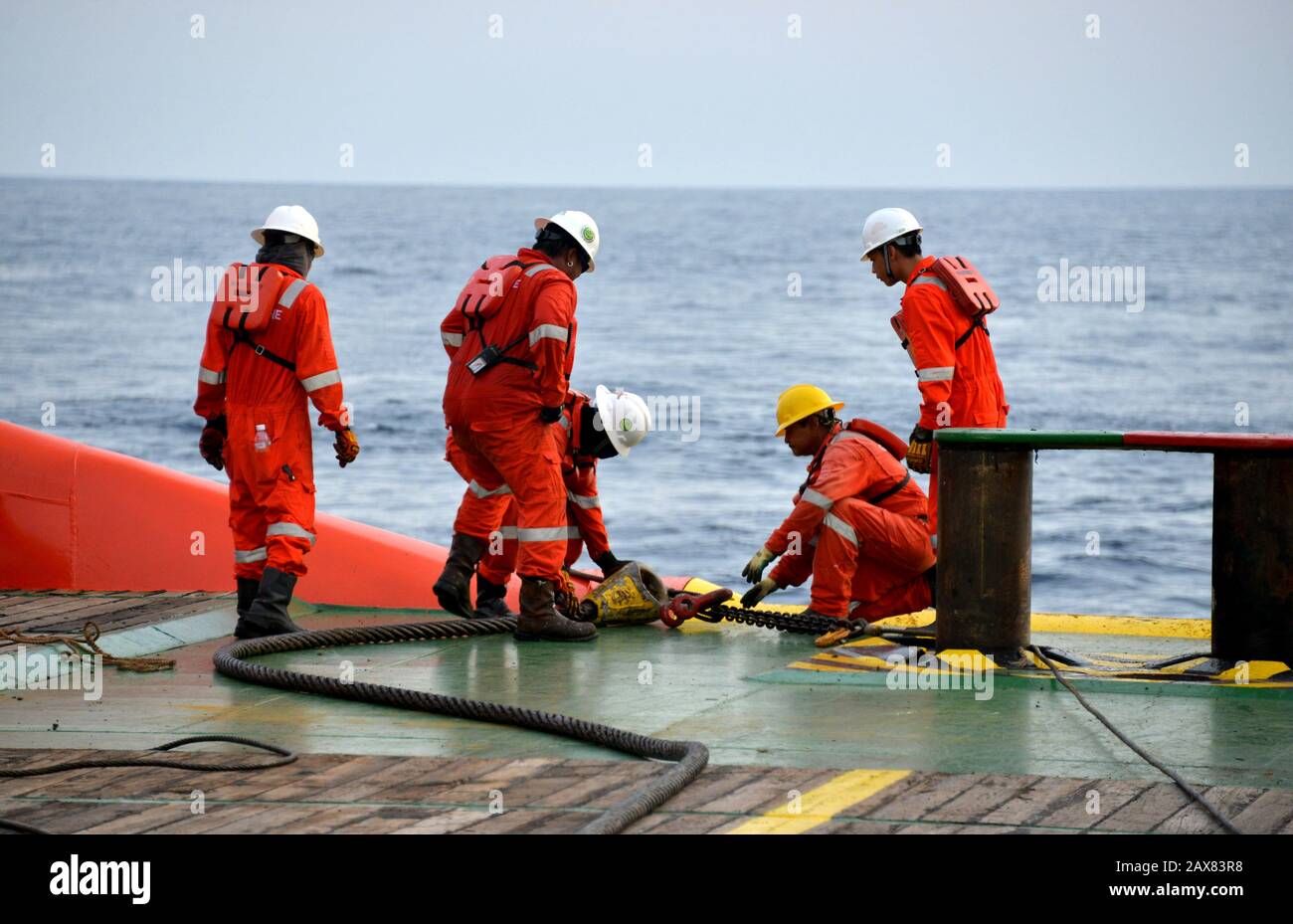 marine crew commencing work on deck for anchor handling operation Stock ...