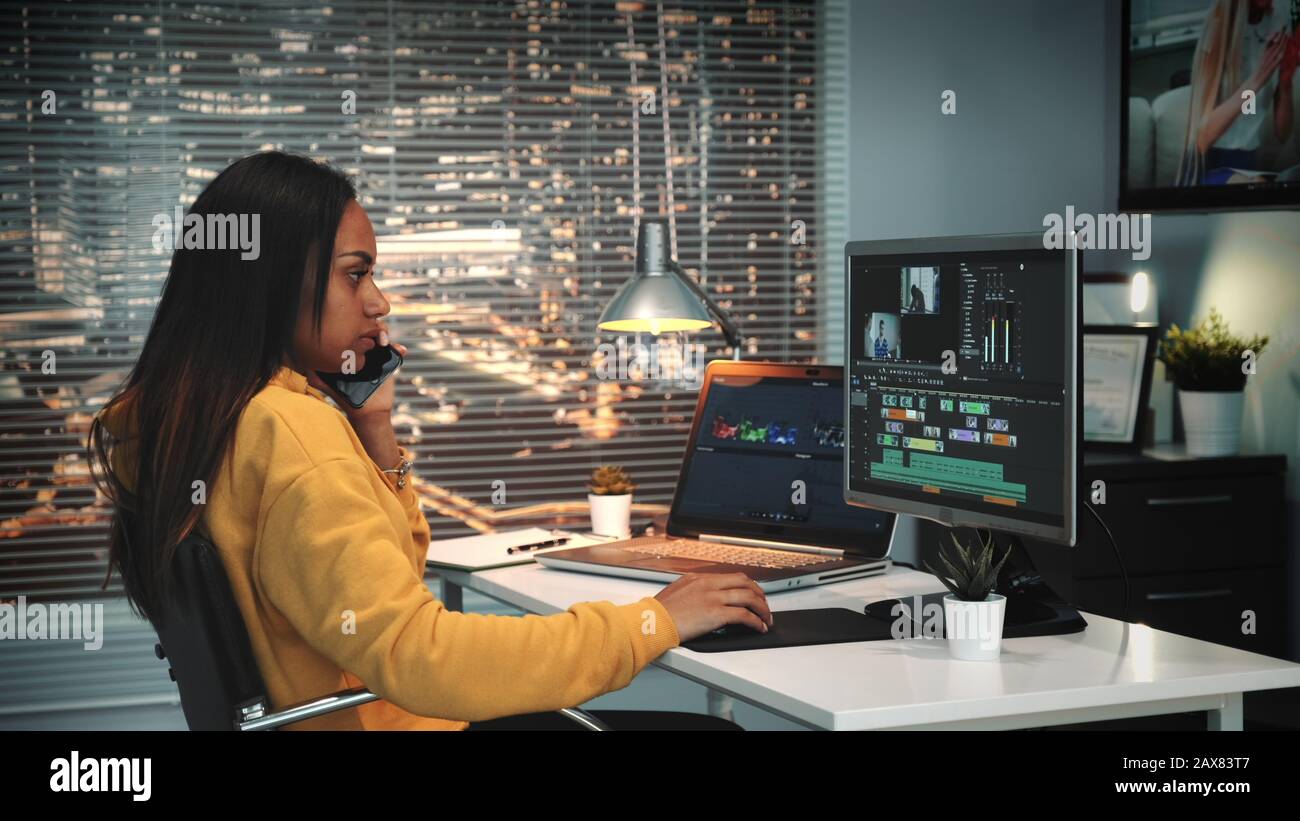 Back view female video editor hi-res stock photography and images - Alamy