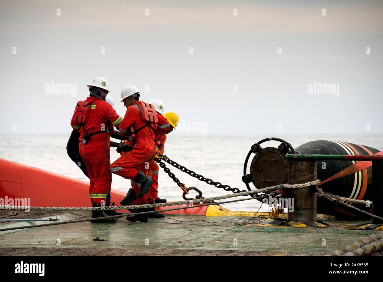 marine crew commencing work on deck for anchor handling operation Stock ...