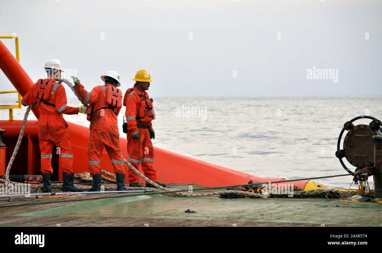 marine crew commencing work on deck for anchor handling operation Stock ...