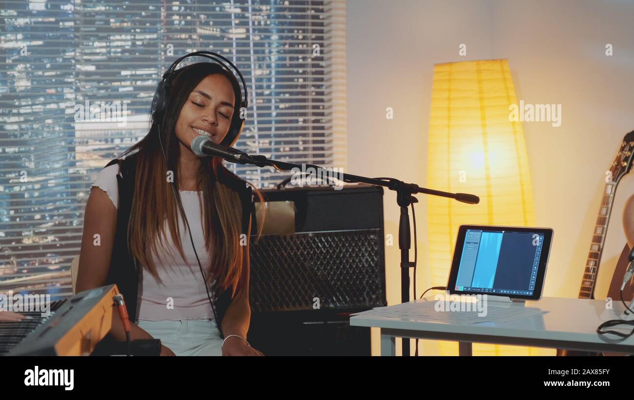 Woman emotionally singing in recording hi-res stock photography and ...