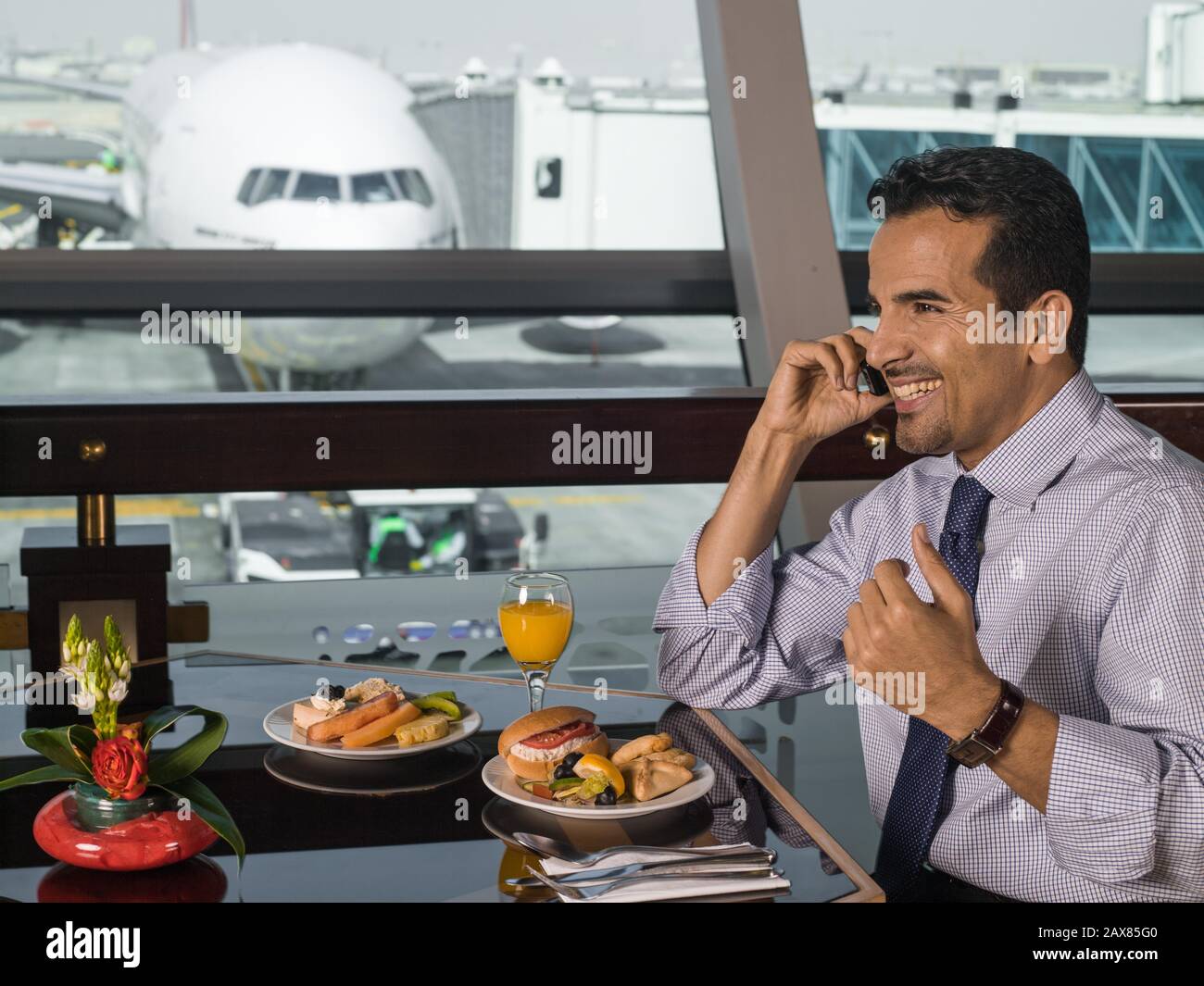 Man having breakfast at DNATA Airport, Dubai, UAE Stock Photo - Alamy