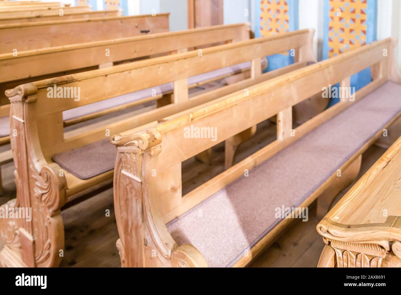 wooden benches in Catholic church Stock Photo - Alamy