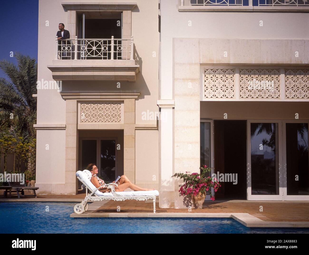 Relaxing by the pool, Emirates Hills. Dubai, UAE Stock Photo - Alamy