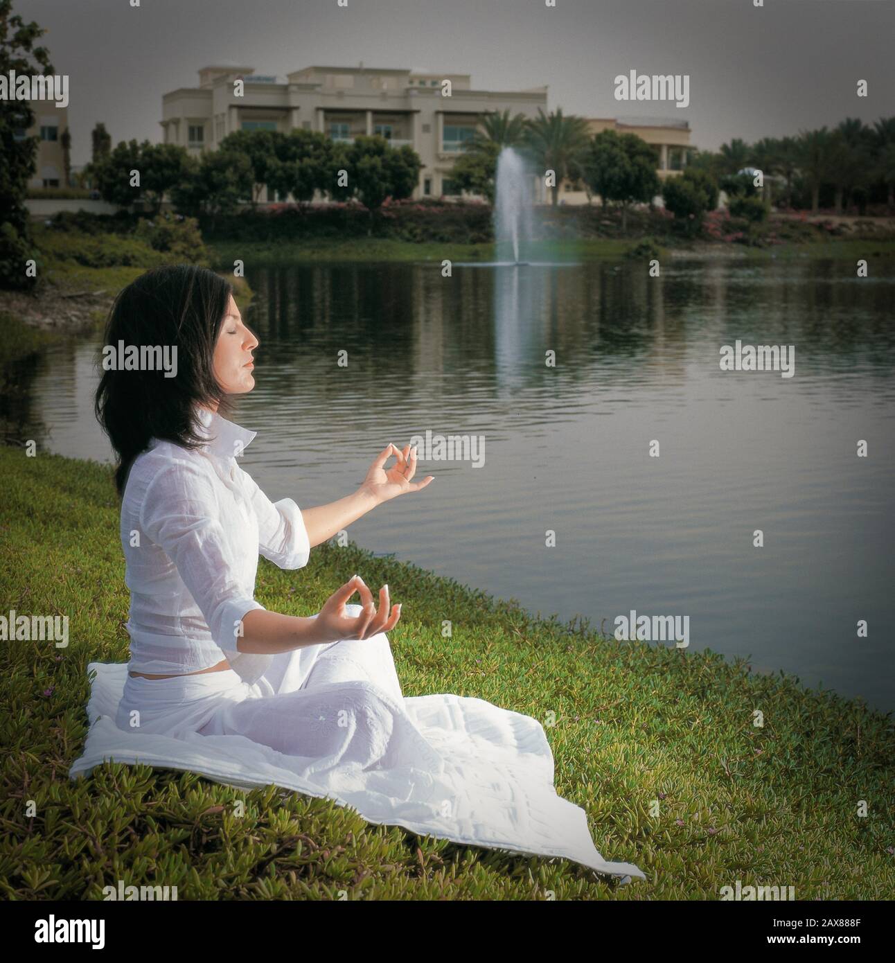 Meditation by the lake. Emirates Hills. Dubai, UAE Stock Photo - Alamy