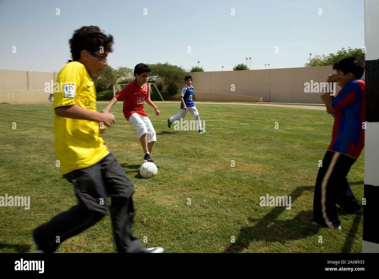 Students enjoy a game of football during their PE class at the Kingdom ...