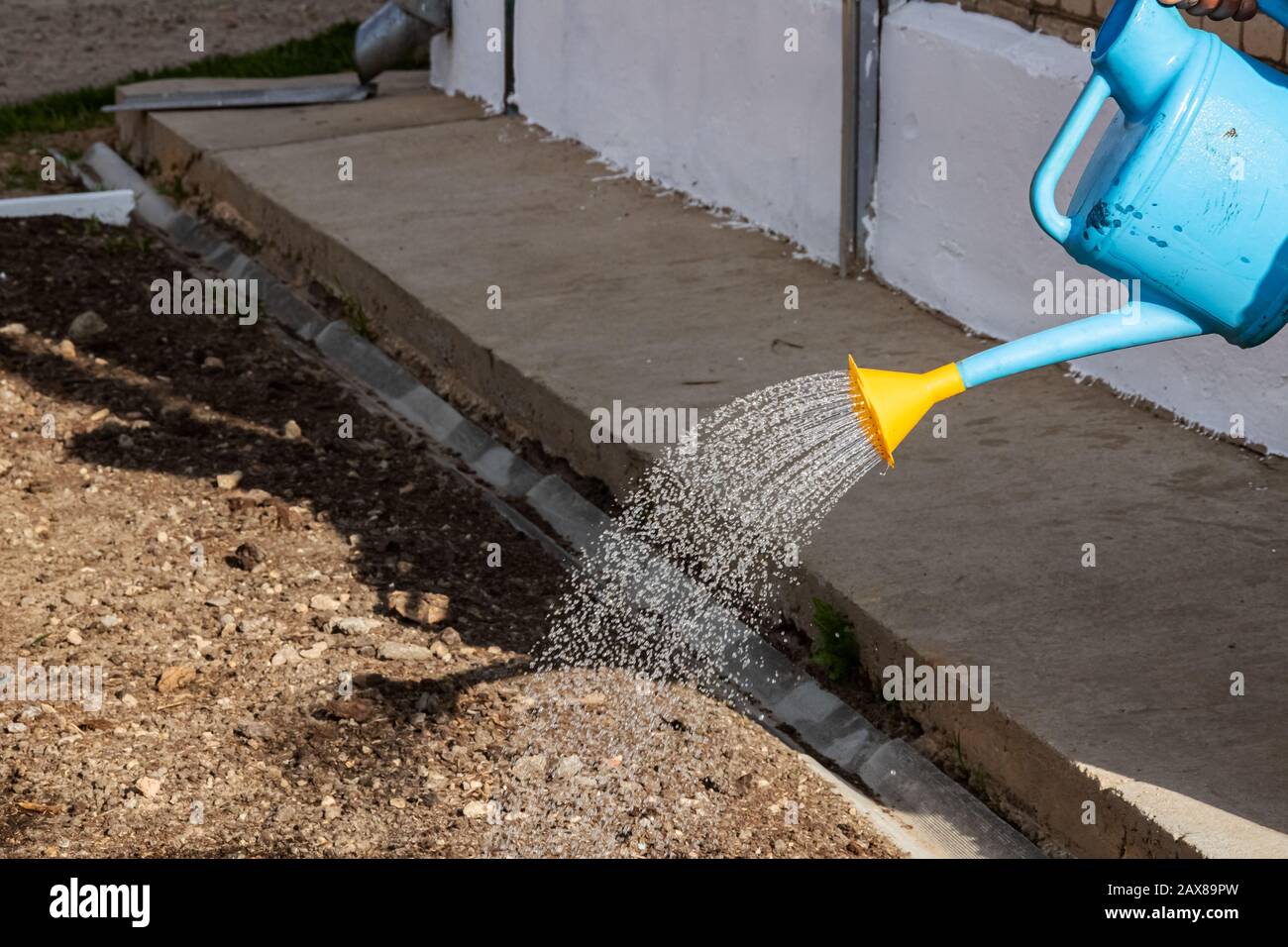 Water spray from watering can, watering plants Stock Photo - Alamy