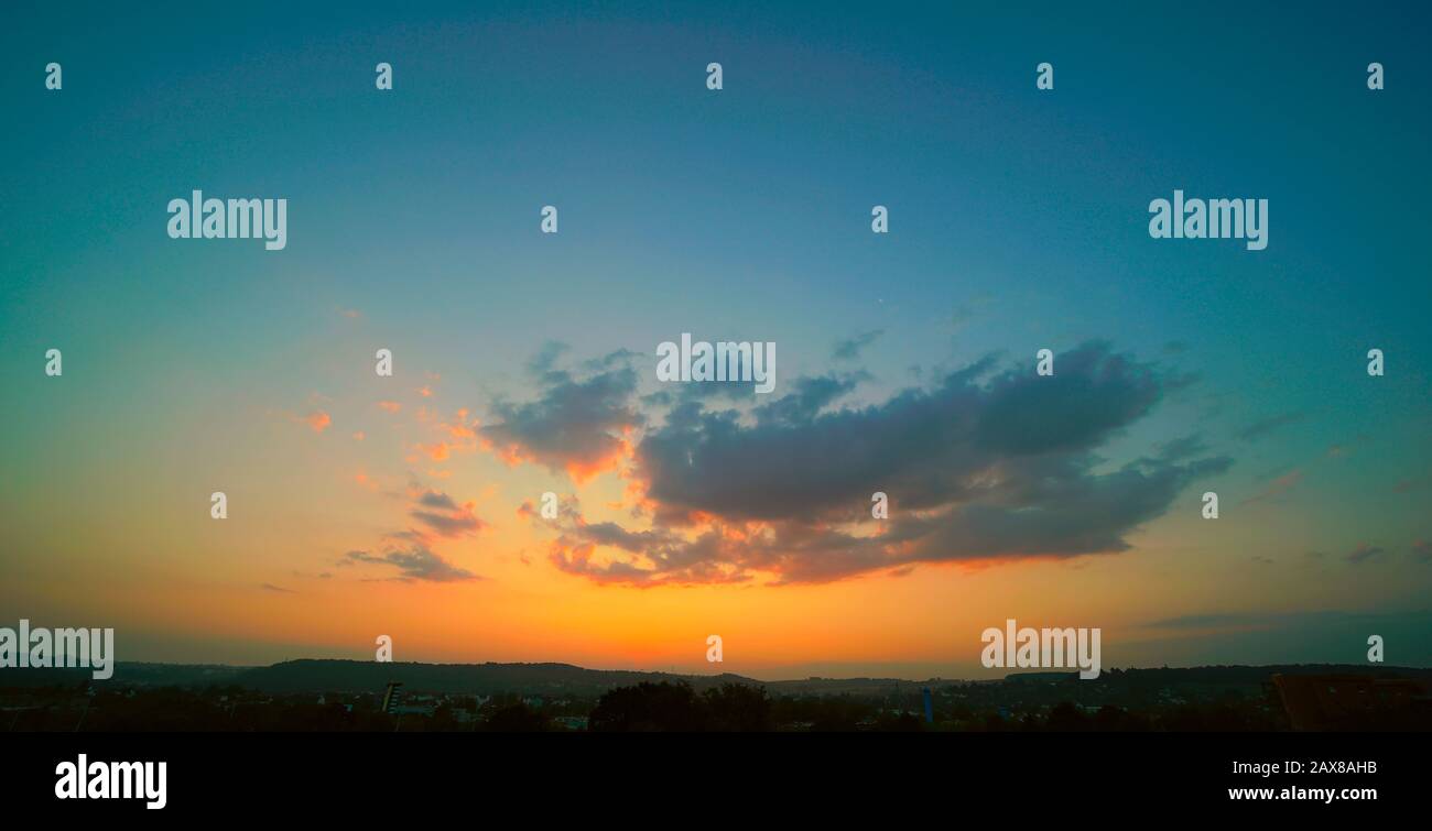 Beautiful sunset sky above clouds with dramatic light Stock Photo - Alamy