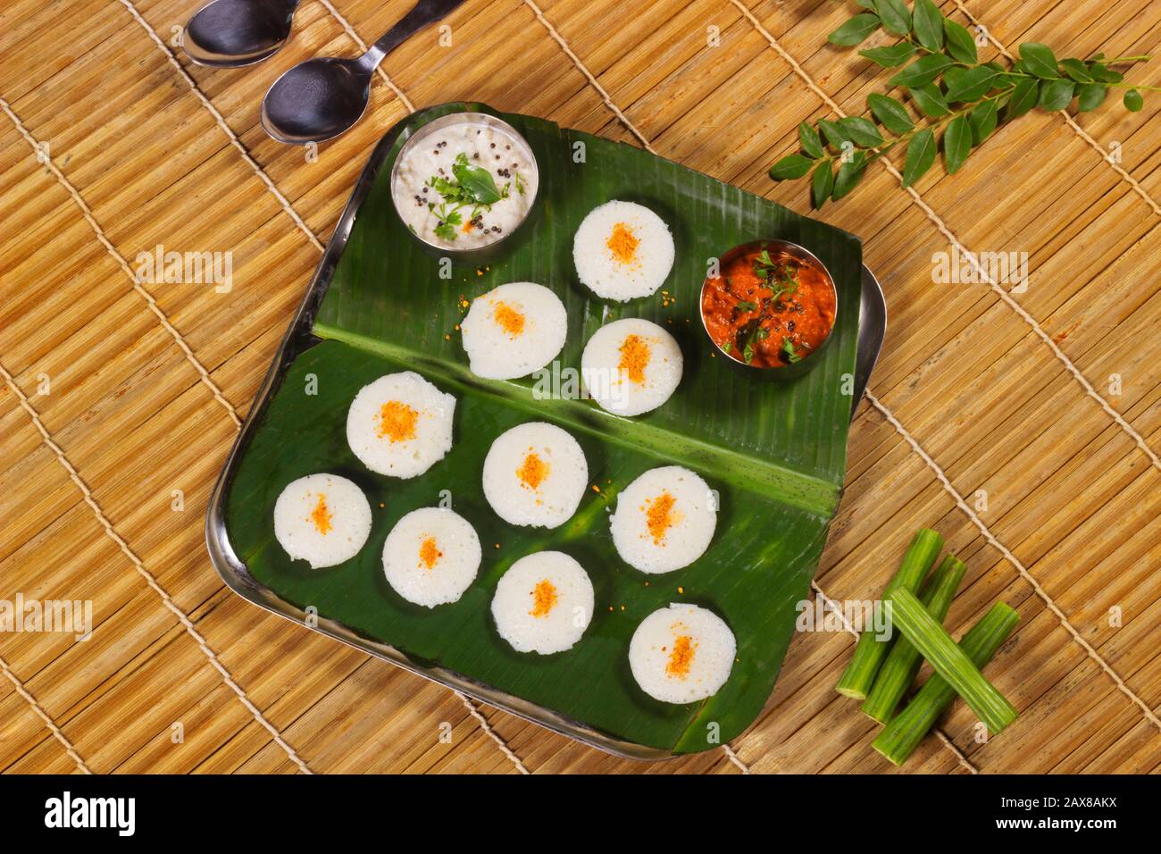 Plain rava idli with chutney served on banana leaf Stock Photo - Alamy
