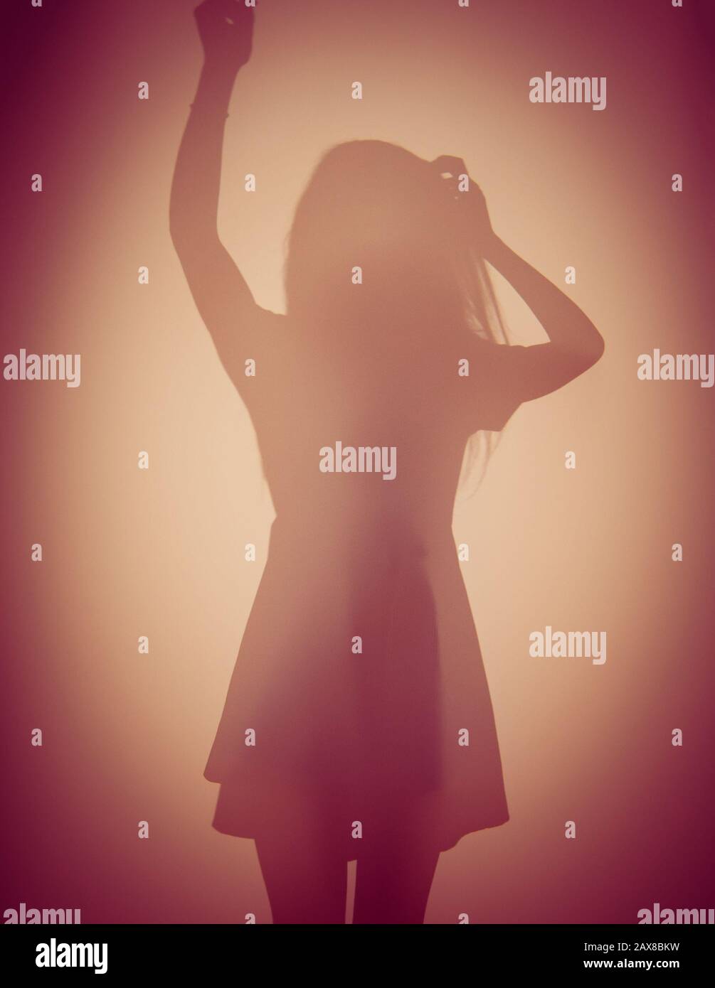 Blurred photo girl wearing dress dancing behind glass Stock Photo - Alamy
