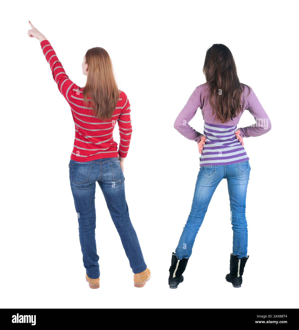 Back view of two pointing young girl in sweater. Rear view people ...