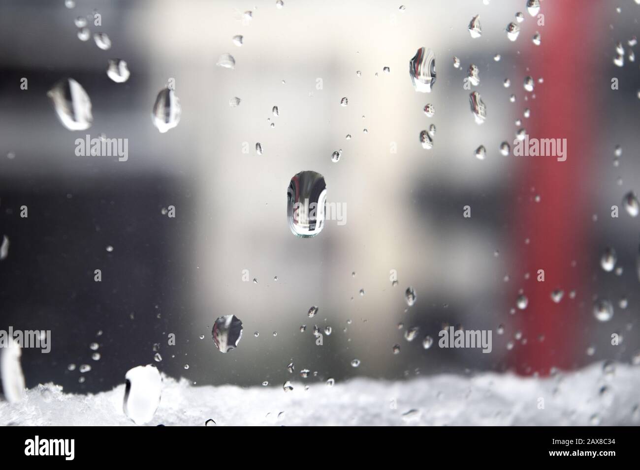 Raindrops on glass in light hi-res stock photography and images - Alamy