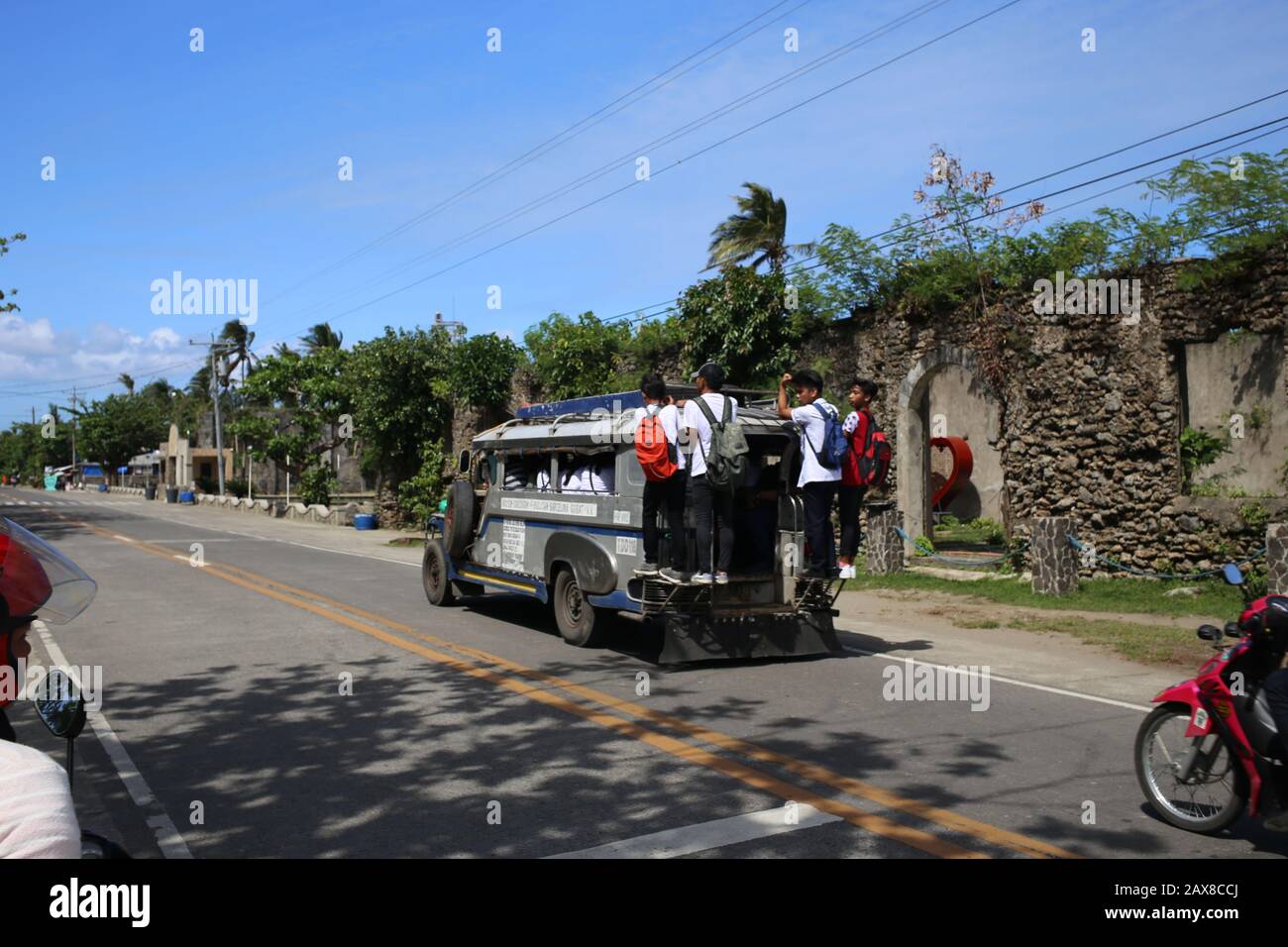 Jeepney driving down a street in The Philippines Stock Photo - Alamy