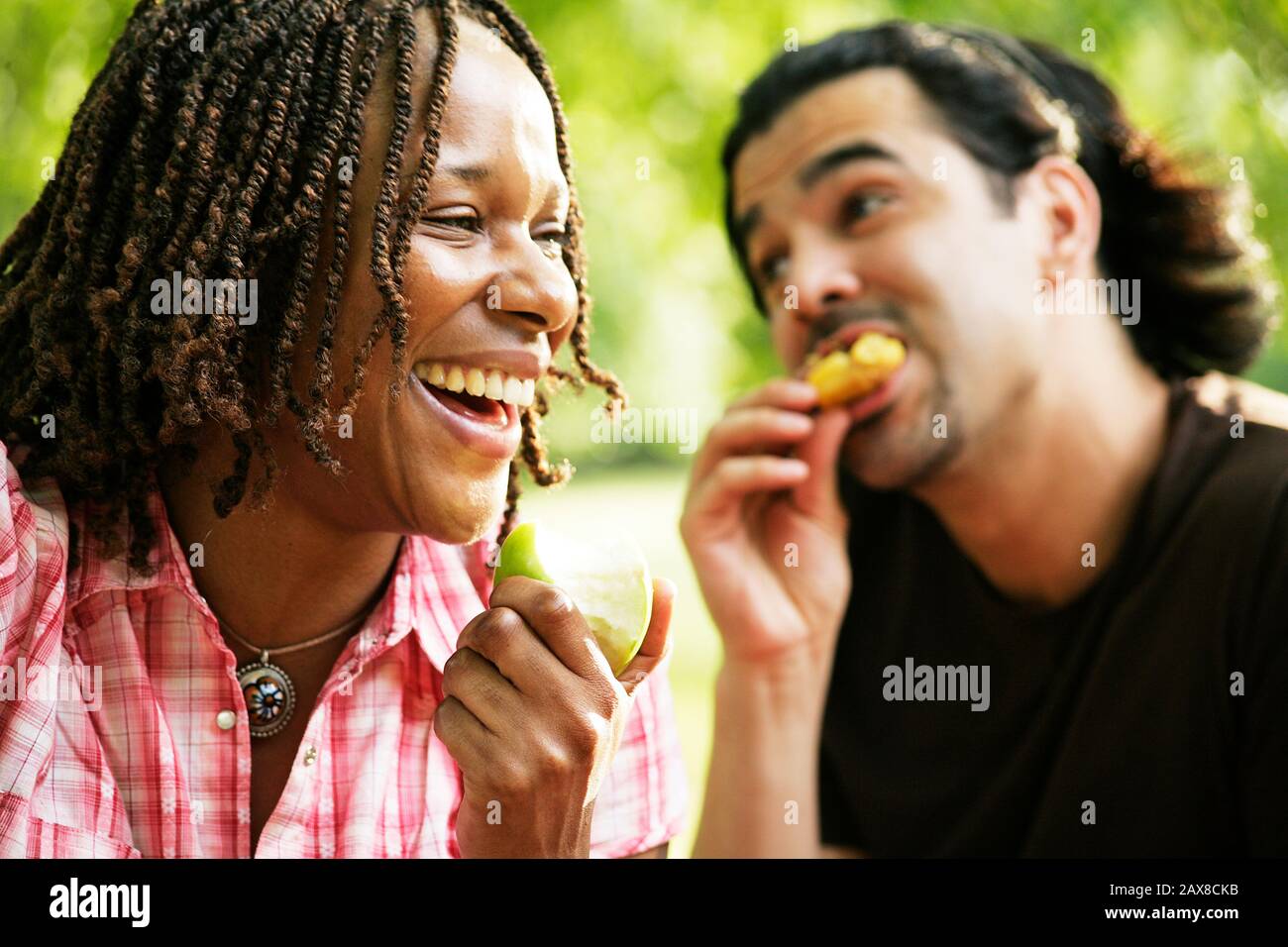 A group of friends eating together Stock Photo - Alamy