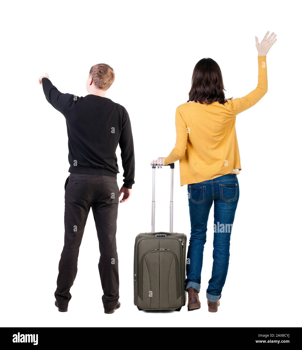 young couple in sweater traveling with suitcas. Back view. Rear view ...