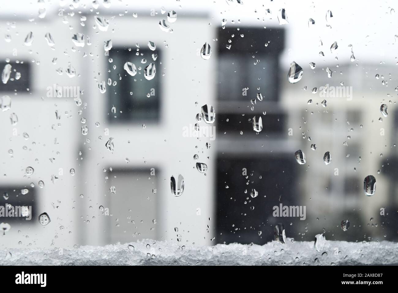 Raindrops on glass in light hi-res stock photography and images - Alamy